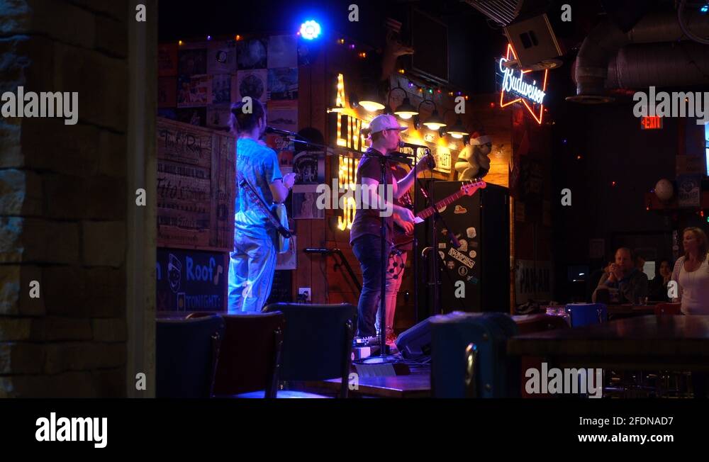 Band Performing At Outdoor Night Club With Beer Budweiser Sign And ...