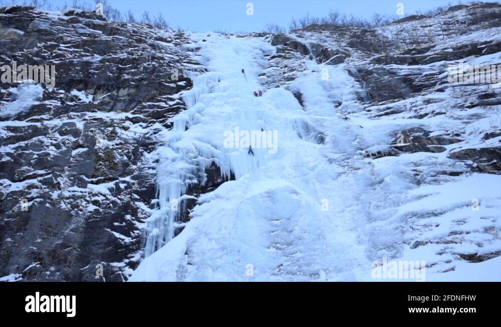 A Team of Ice Climbers Scaling an Impressive Ice Wall, Wide Stock Video ...