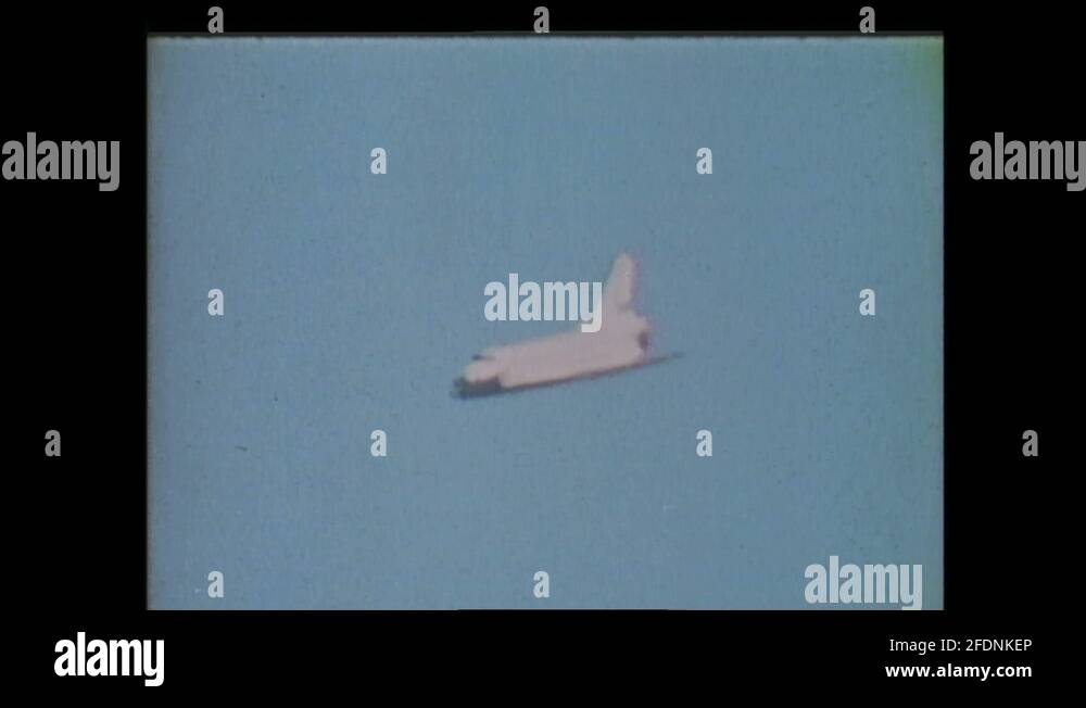 1990s: Space shuttle flies through sky toward runway. Space shuttle ...