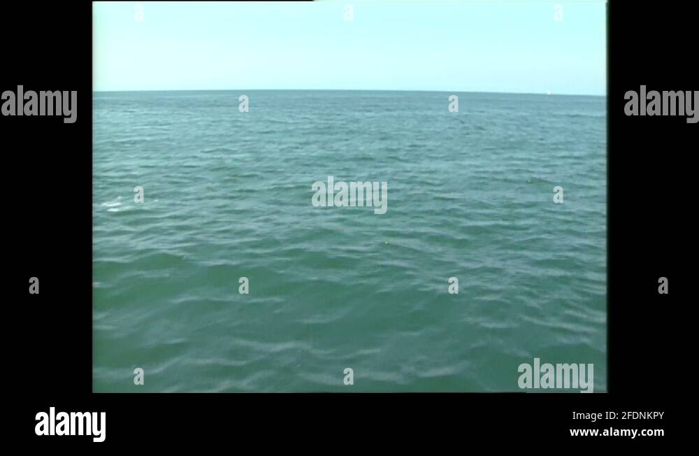 1990s: People play in the ocean. Earth. The sun. Boats. Animated map ...