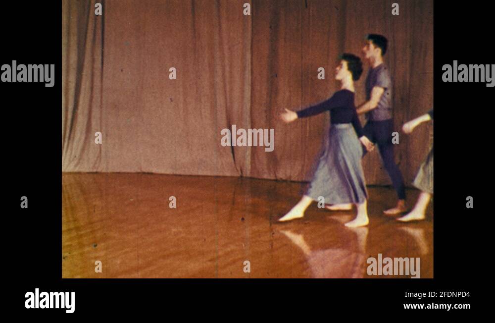 1960s: three dancers walk across studio, two dancers skip across studio ...