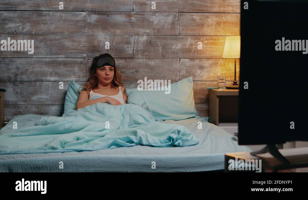 Woman in pajamas clapping to turn off the lights Stock Video Footage ...