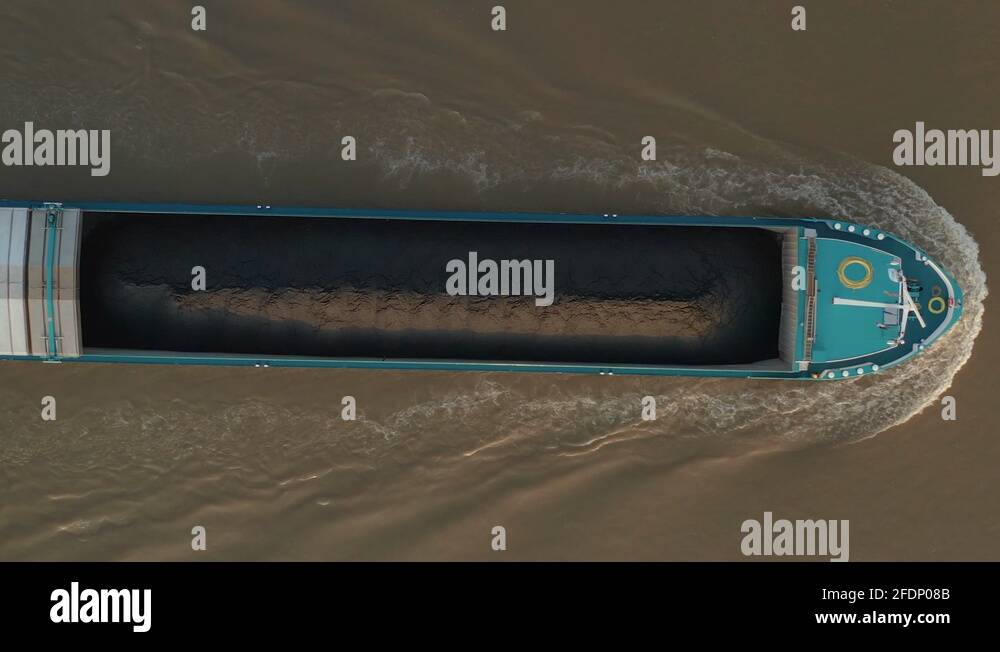 Top shot of a top of a ship boat load and transport coal with a radar ...
