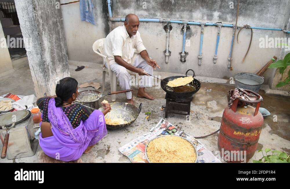 Vendors making Indian street food or festival snacks (Diwali Snacks ...