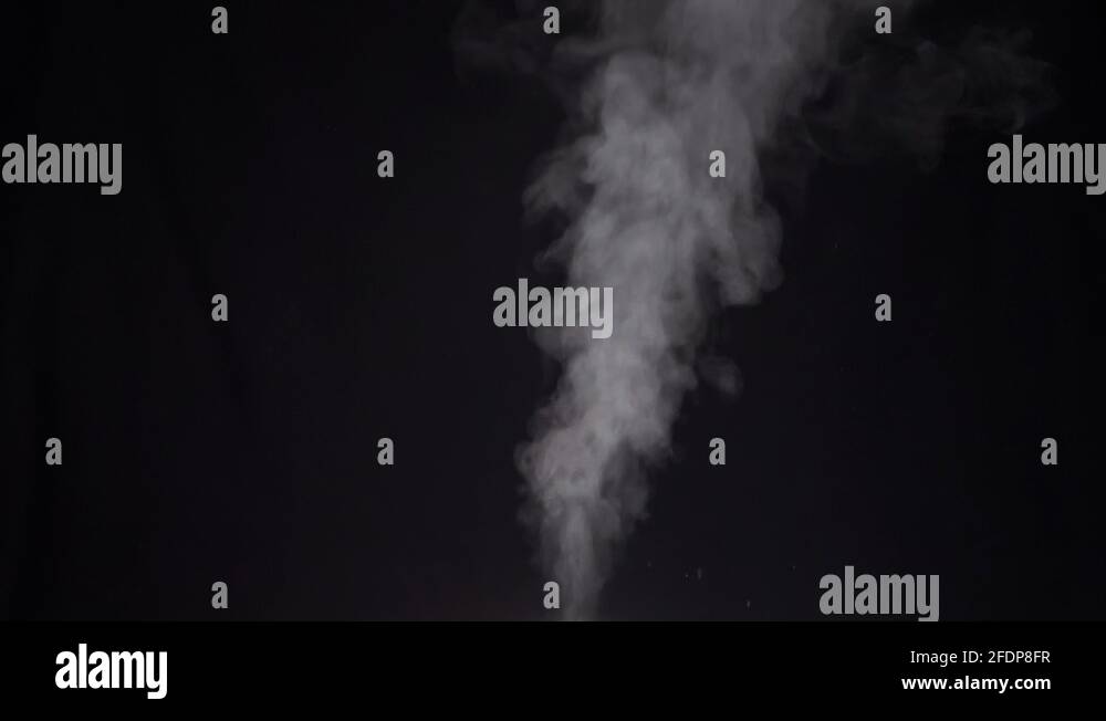 Water Vapor. White Jet of Vapour Steam on Black Background. Slow Motion ...