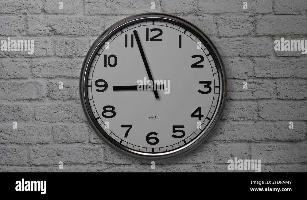 The Time On The Clock Nine. Clock With The Black Arrows With The Arabic ...