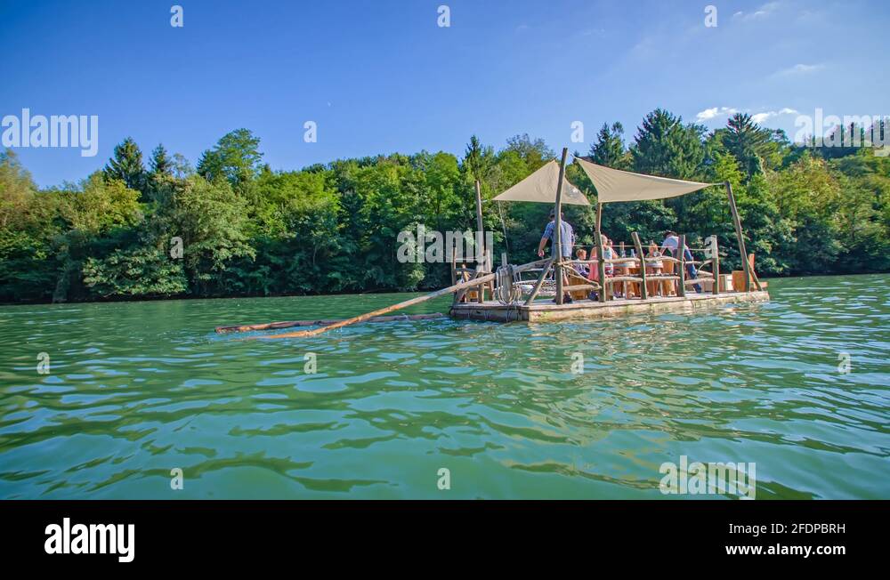 Caucasian family enjoys raft picnic adventure on the Drava river,Muta ...