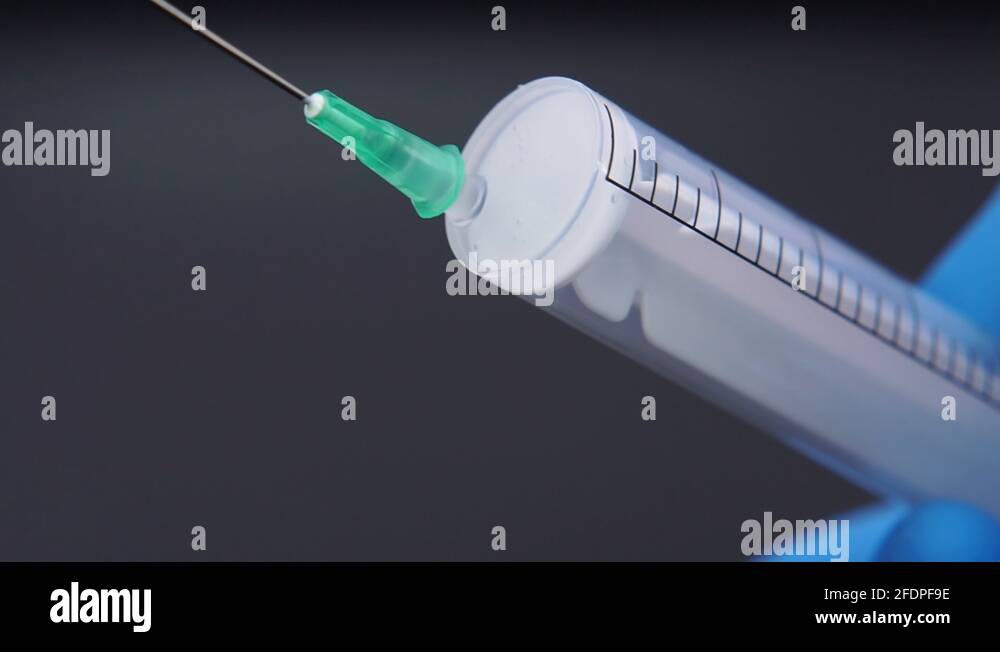 Medicine leaking from a syringe drop by drop Stock Video Footage - Alamy