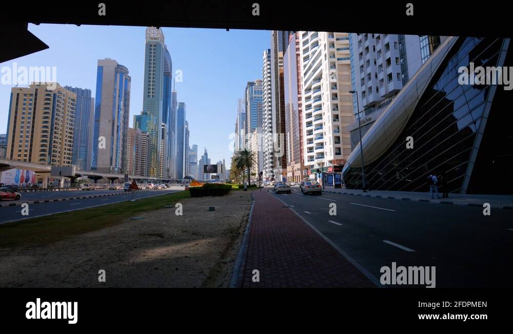 Low angle tilt up view toward tall skyscrapers in downtown Dubai ...