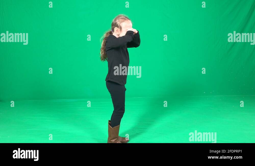 CRYING LITTLE GIRL SIDE VIEW GREENSCREEN Stock Video Footage - Alamy
