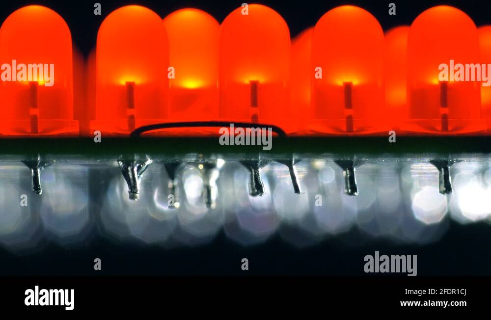 Big red LEDs turning on and off with rack focus on solder joints Stock ...