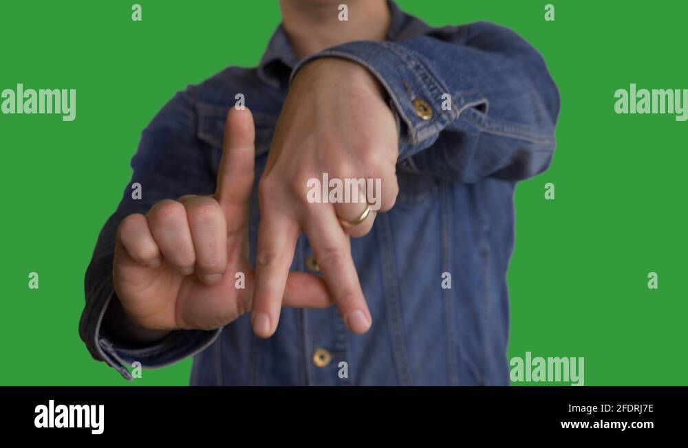 Casually dressed male makes LA hand sign - Los Angeles, California ...