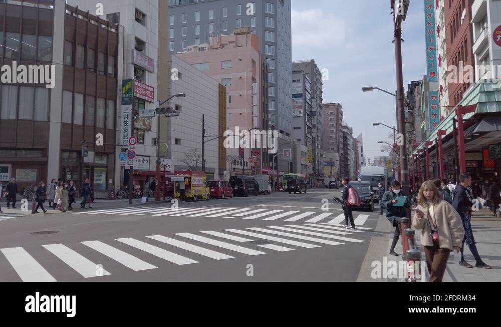 Japanese people walking across road in Asakusa district of Tokyo Stock ...