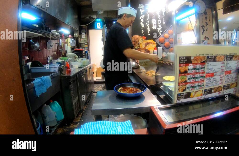 Inside Japanese Okonomiyaki restaurant. Preparation process Stock Video ...