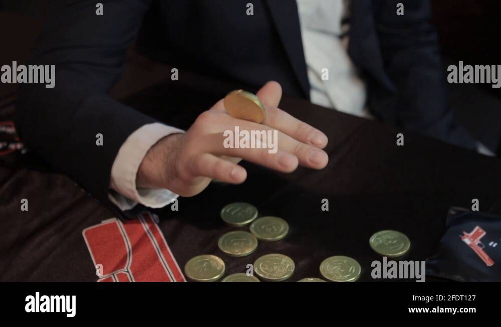 a man hand is sorting a gold coin between fingers Stock Video Footage ...