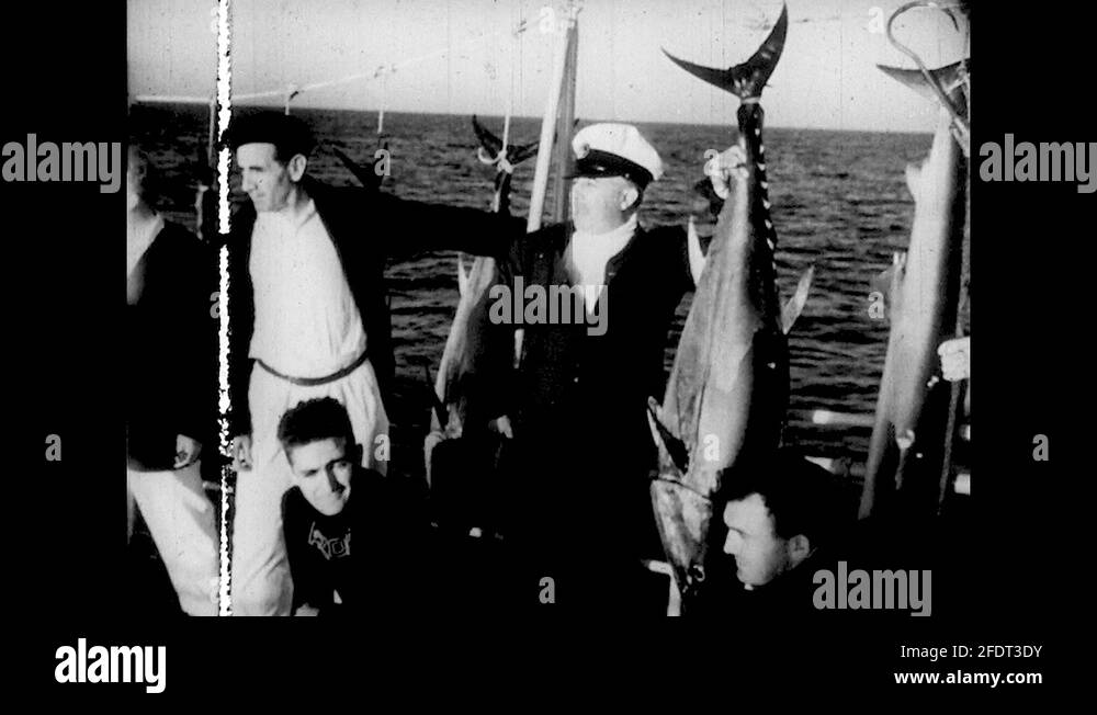 1960s: men posing with caught fish, people cheering as two men shake ...