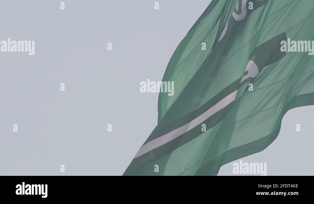 The largest flag of Saudi Arabia waving in the sky in slow motion Stock ...