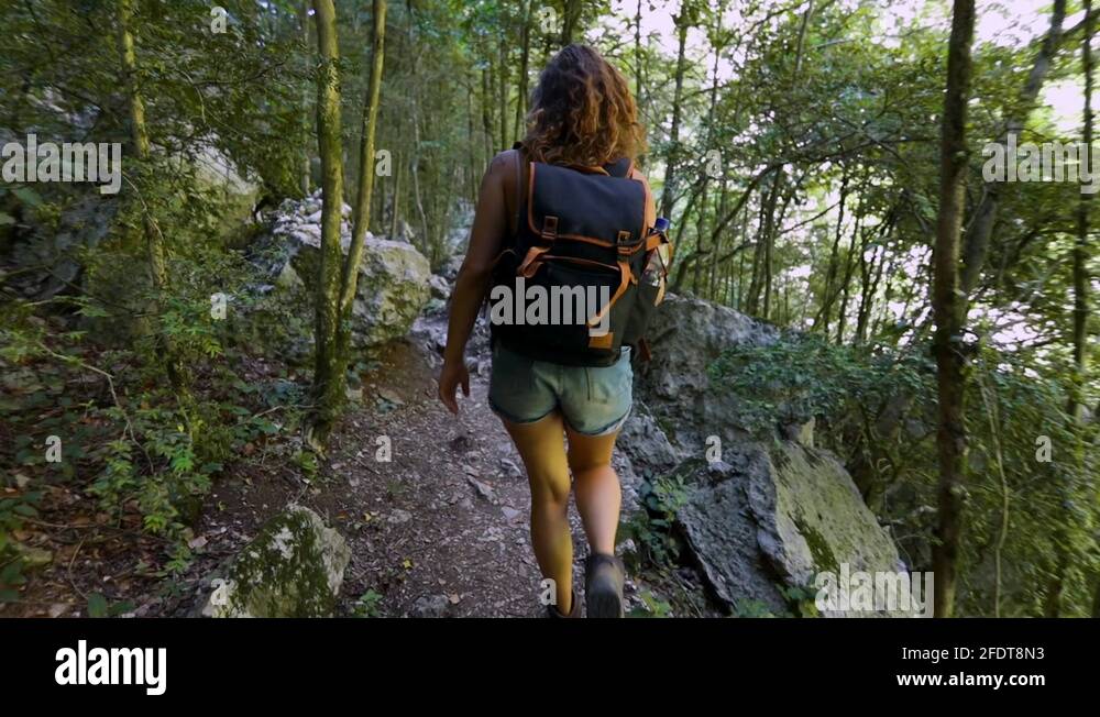 Woman walking on a trail in nature Stock Videos & Footage - HD and 4K ...
