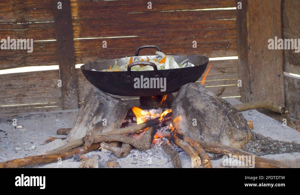 wok in a outdoor kitchen house. Old cooking pot stove using firewood ...
