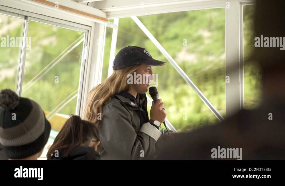 Female Tour Guide Pointing and Giving Tour, HD Stock Video Footage - Alamy