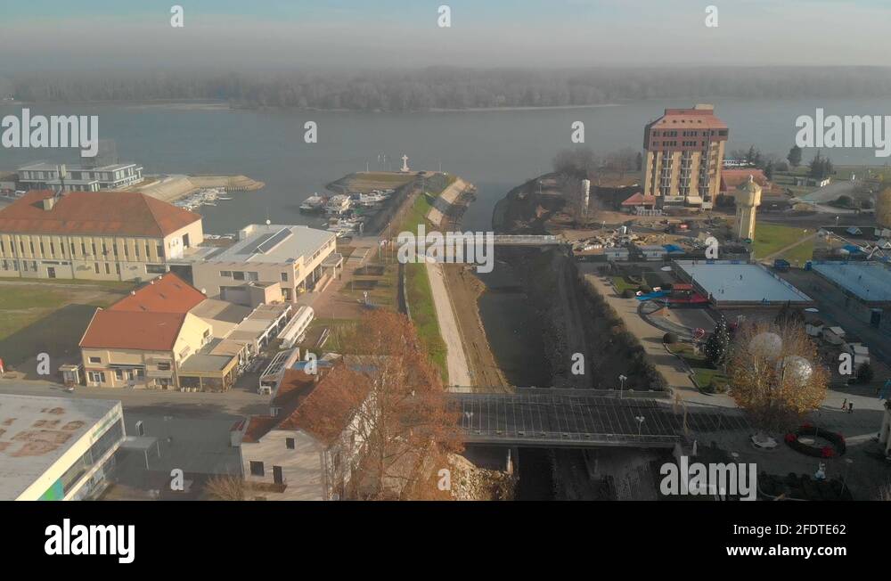 Mist shrouded Danube river, Memorial cross at the mouth of Vuka ...