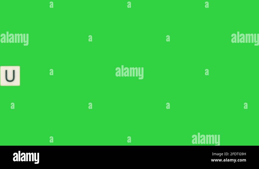 Letter U scrabble slide from left to right side on green screen, letter ...