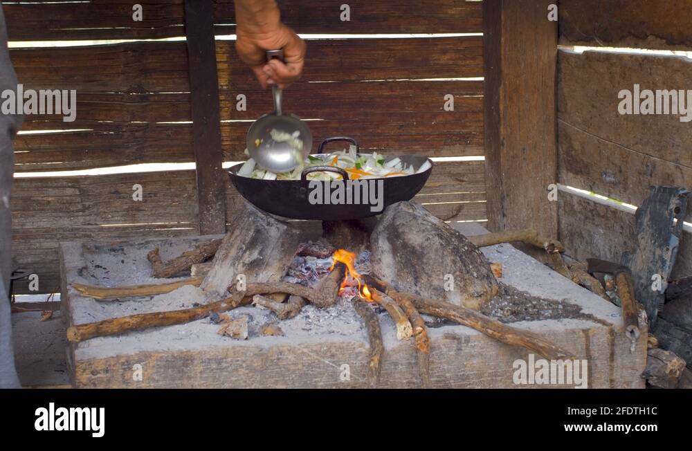 wok in a outdoor kitchen house. Old cooking pot stove using firewood ...