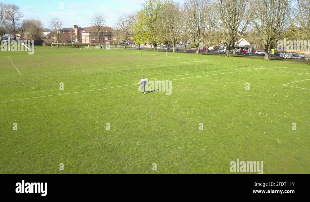 Young man running around in a empty football field Stock Video Footage ...