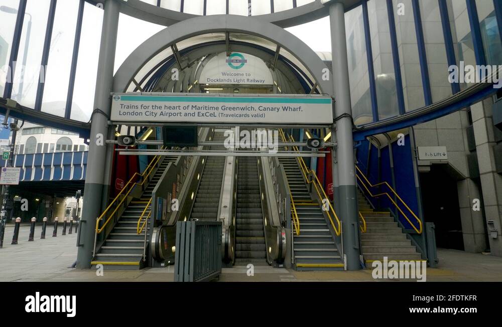 Tower Gateway London DLR station entrance, empty stair and escalators ...