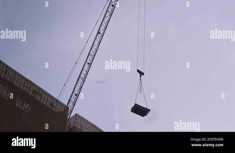 Crane lifting construction materials Stock Videos & Footage - HD and 4K ...