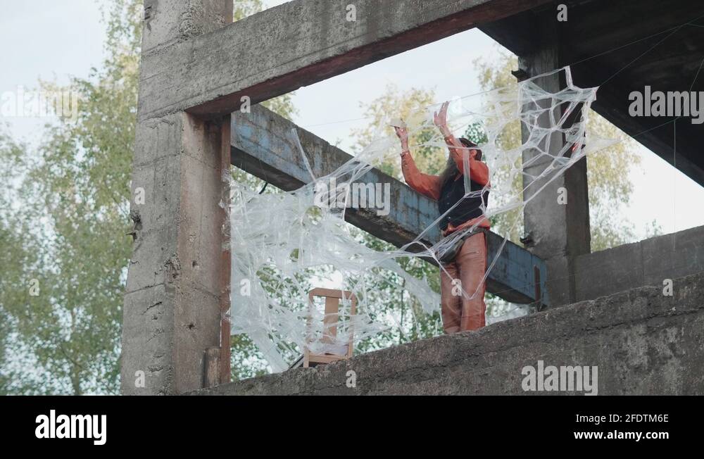 Adult Male Using Tape To Add Webbing On Art Installation At The Black ...