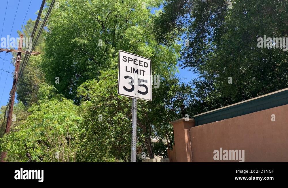 Speed limit sign trees blue Stock Videos & Footage - HD and 4K Video ...