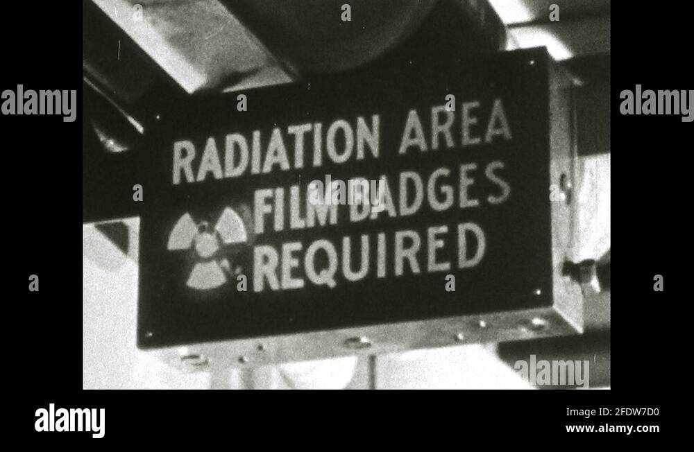1960s: "Radiation Area Film Badges Required" sign, laboratory machinery ...