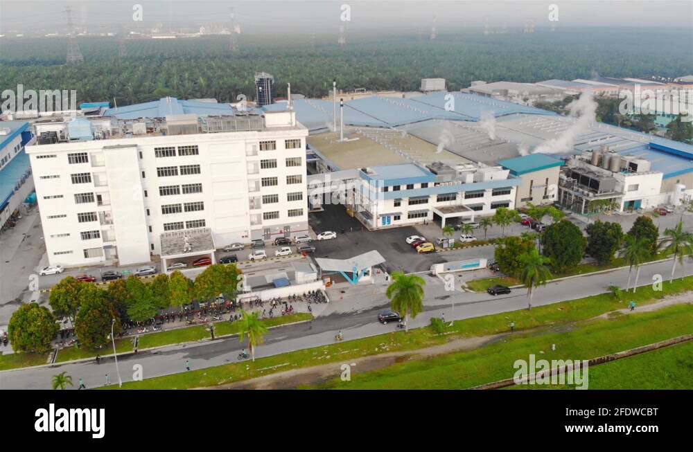 Full Factory Shot From The Side Top View With Car Passing By On ...