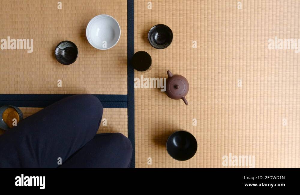 Man Kneeling In Japanese Tatami Mat Flooring Performing Traditional Tea ...