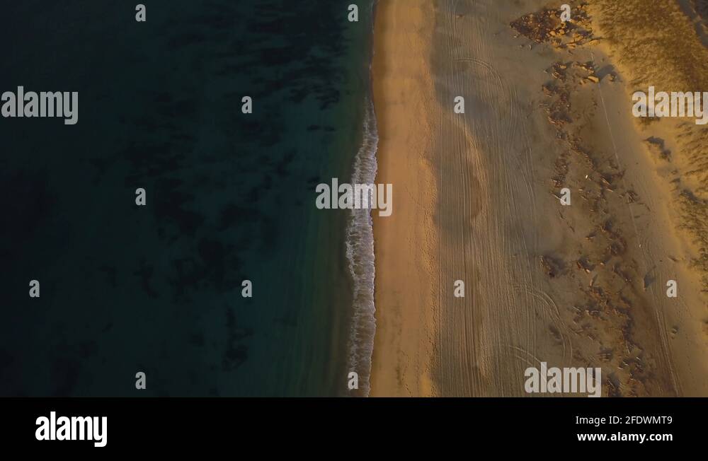 Top Down Aerial View of Empty Sandy Beach and Ocean Waves in Baja Stock ...