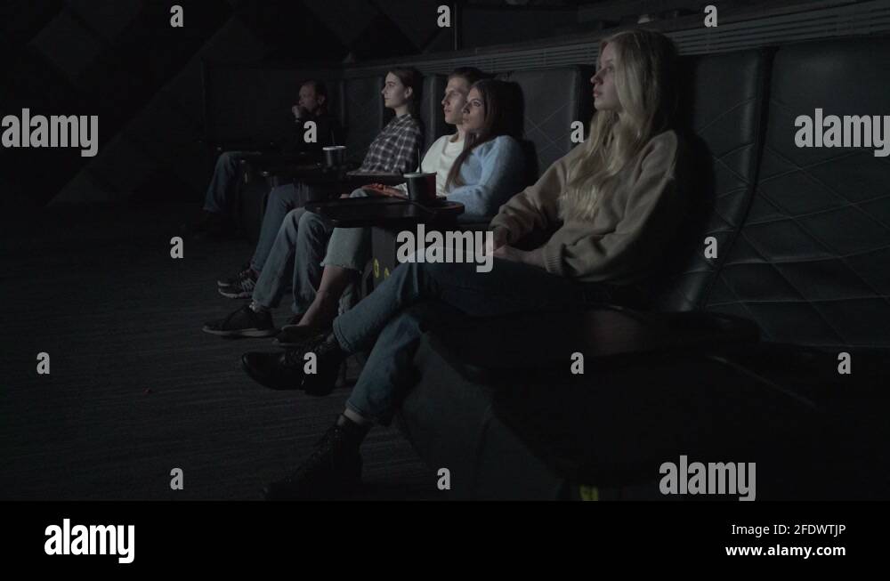 Movie theater, people watching movies in the cinema, portraits of ...