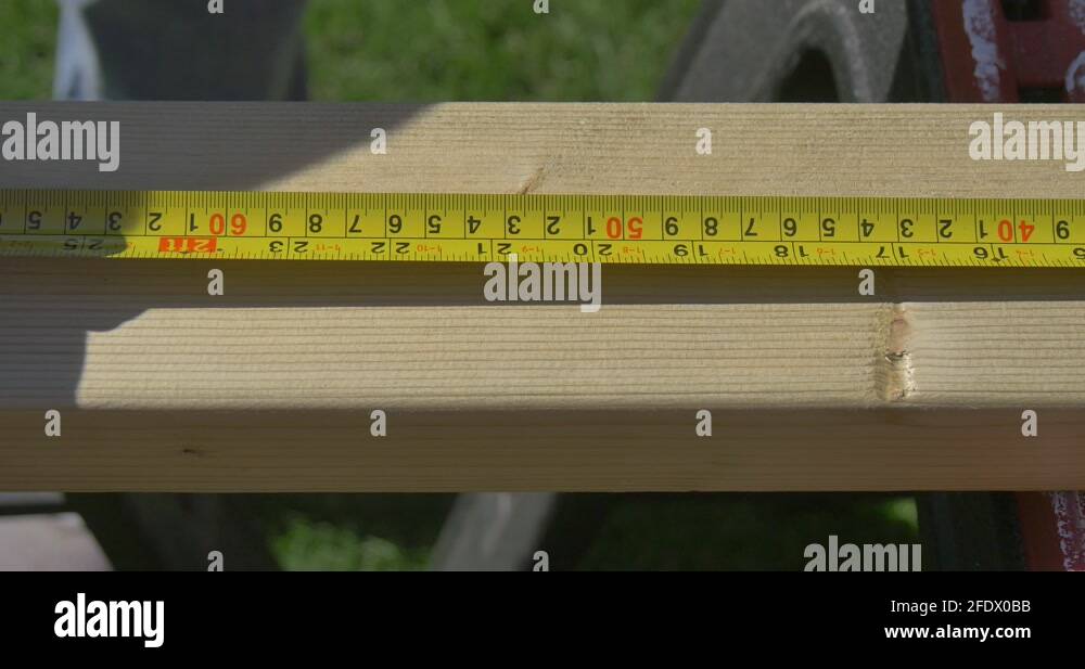 Measuring a piece of timber and marking it Stock Video Footage - Alamy