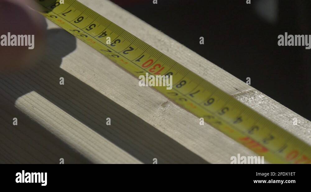 Measuring a piece of timber and marking it Stock Video Footage - Alamy