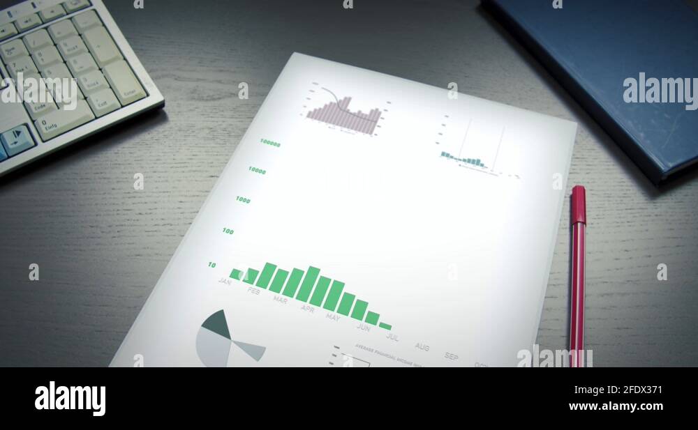 Positive graph develops on a piece of paper on an office table. Digital ...