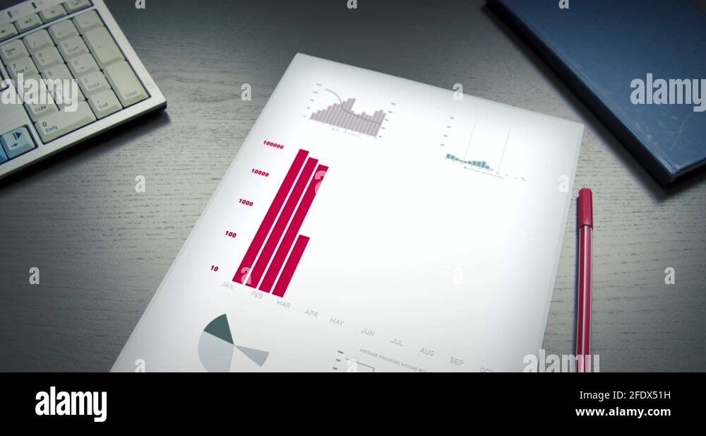 Negative graph develops on a piece of paper on an office table. Digital ...