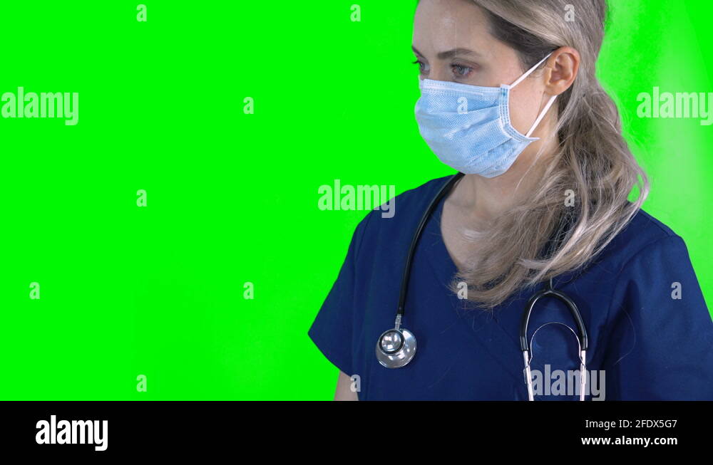 4K Portrait of female nurse doctor on green screen isolated with chroma ...