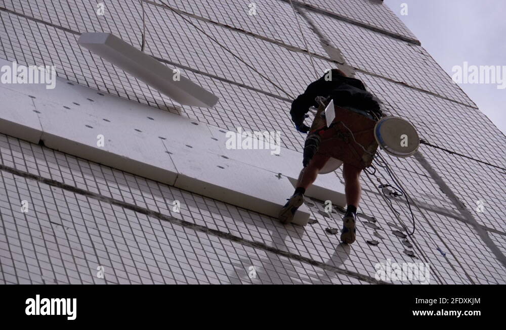 Industrial Climber Insulation of Facade Old High-Rise Building Using ...