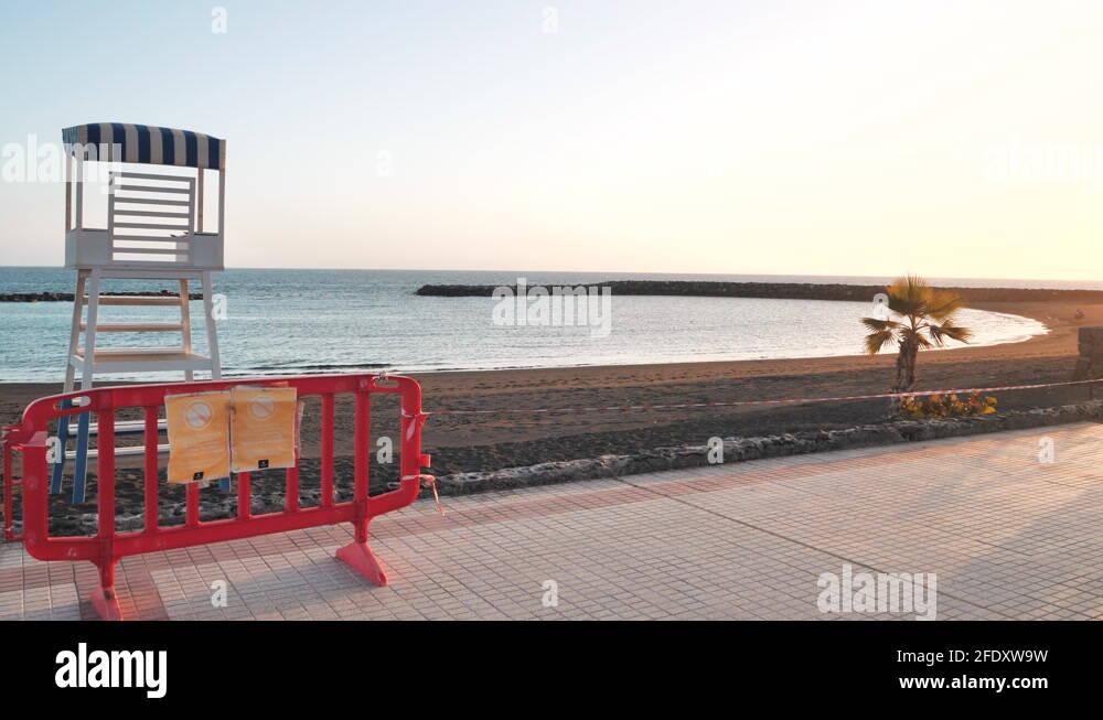 A baywatch chair behind the fence and security seal tape locking the ...