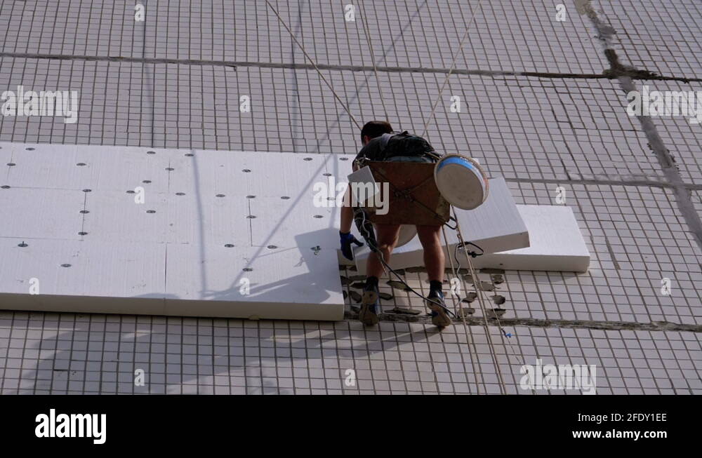 Industrial Climber Insulation of Facade Old High-Rise Building Using ...