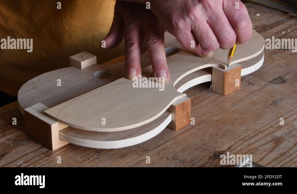Luthier working in the structure of a new violin Stock Video Footage ...