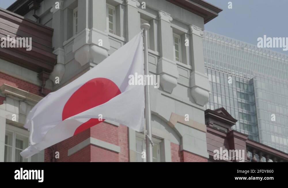 Japanese Flag in front of Tokyo Station in Chiyoda, Tokyo, Japan on an ...