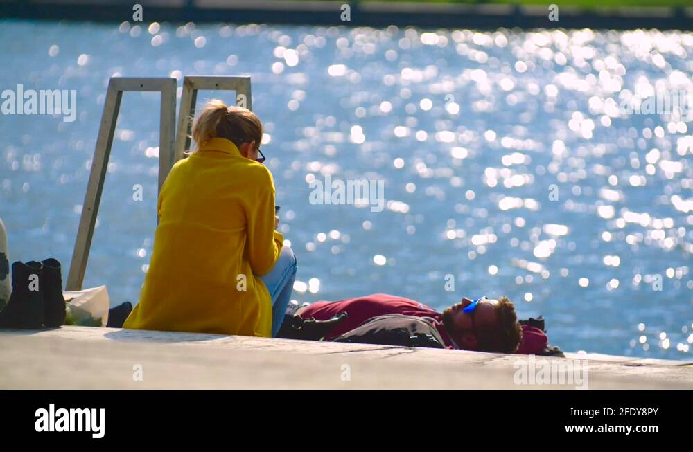 Sunbathing on bank of river Stock Videos & Footage - HD and 4K Video ...