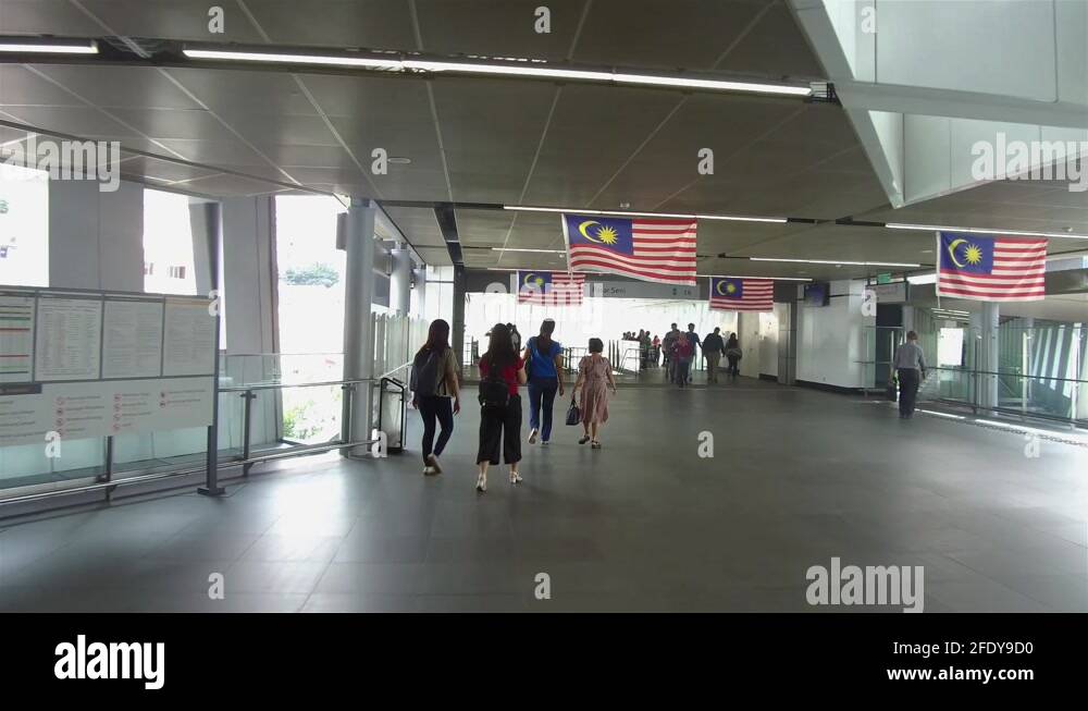 a crowd of people walking from escalator - dolly forward Stock Video ...