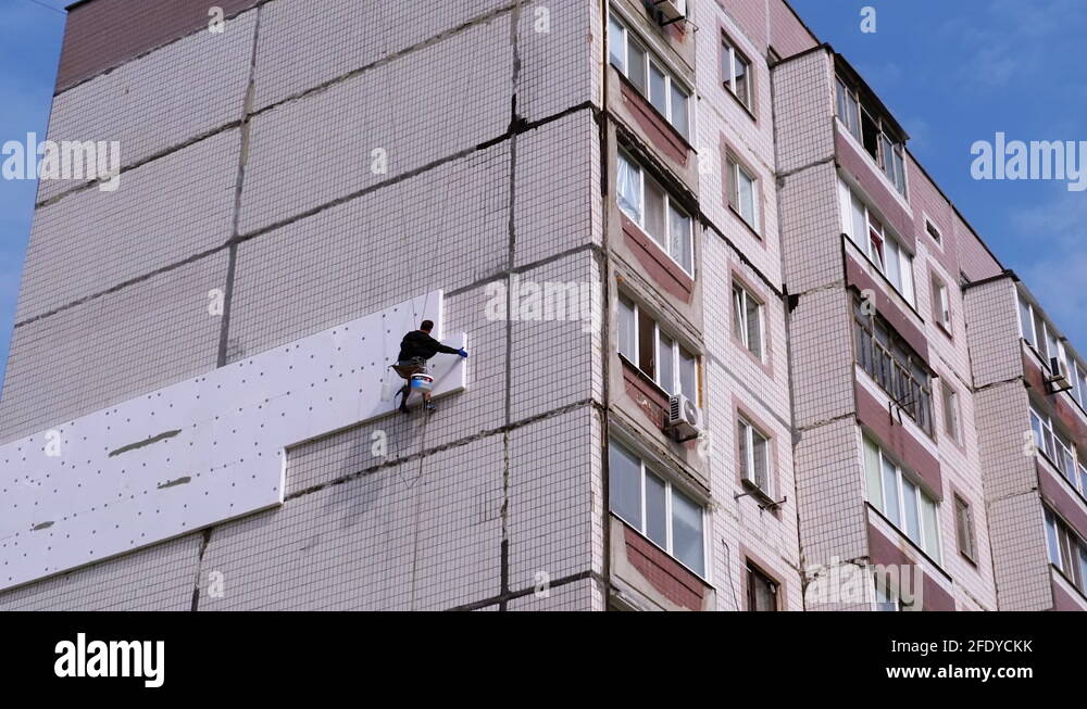 Industrial Climber Insulation of Facade Old High-Rise Building Using ...